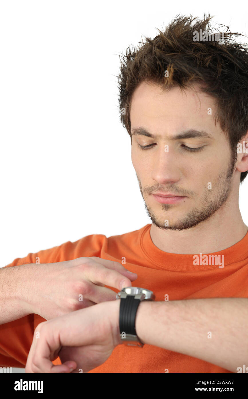 Man tapping his watch Stock Photo - Alamy