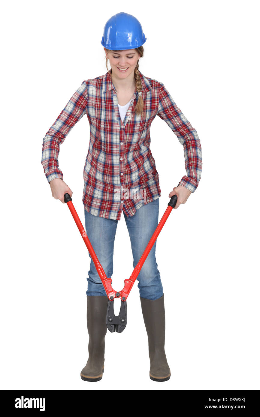 Woman using bolt-cutters Stock Photo - Alamy