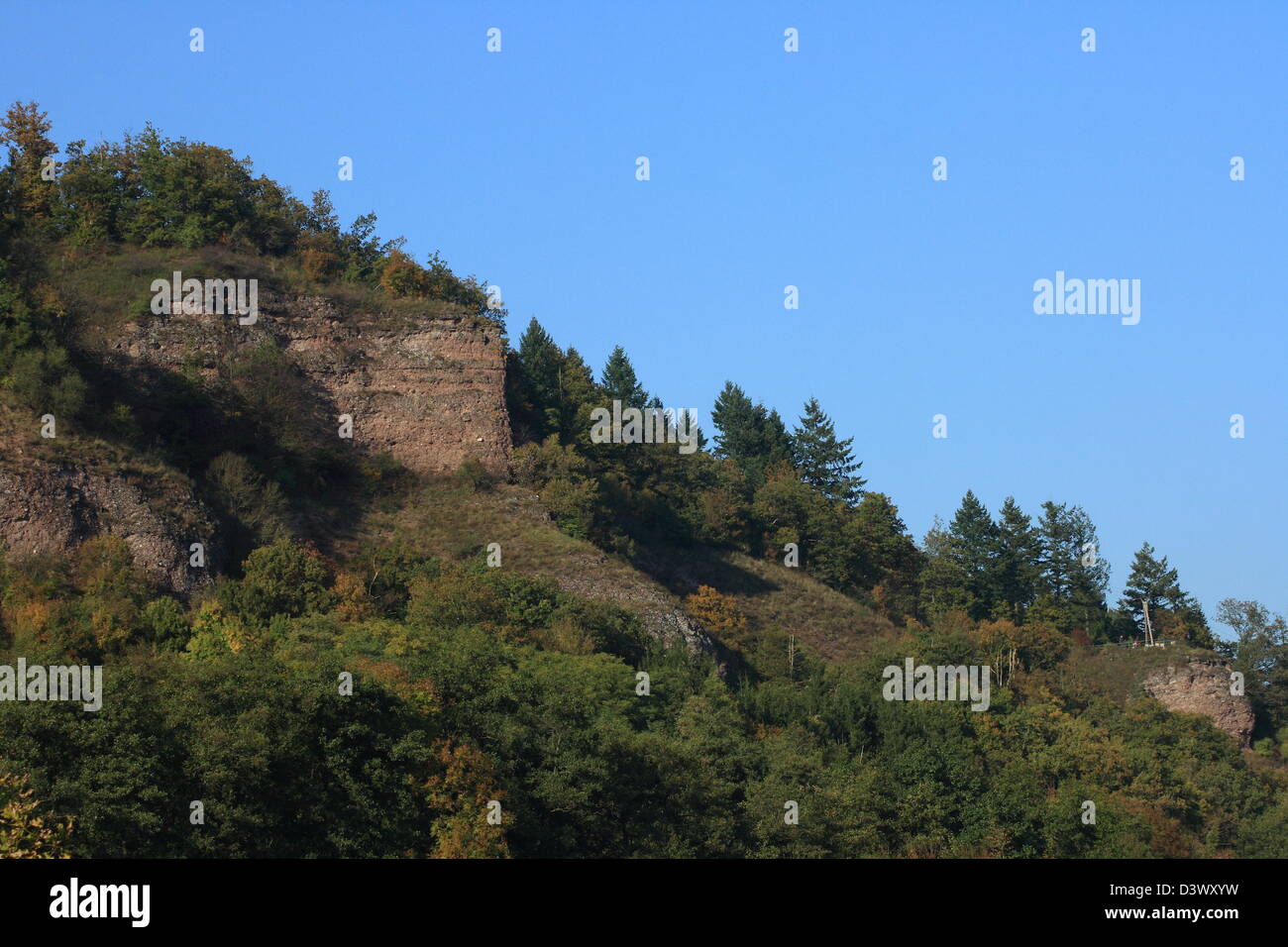 Mid-mountain landscape with trees and blue sky Stock Photo - Alamy