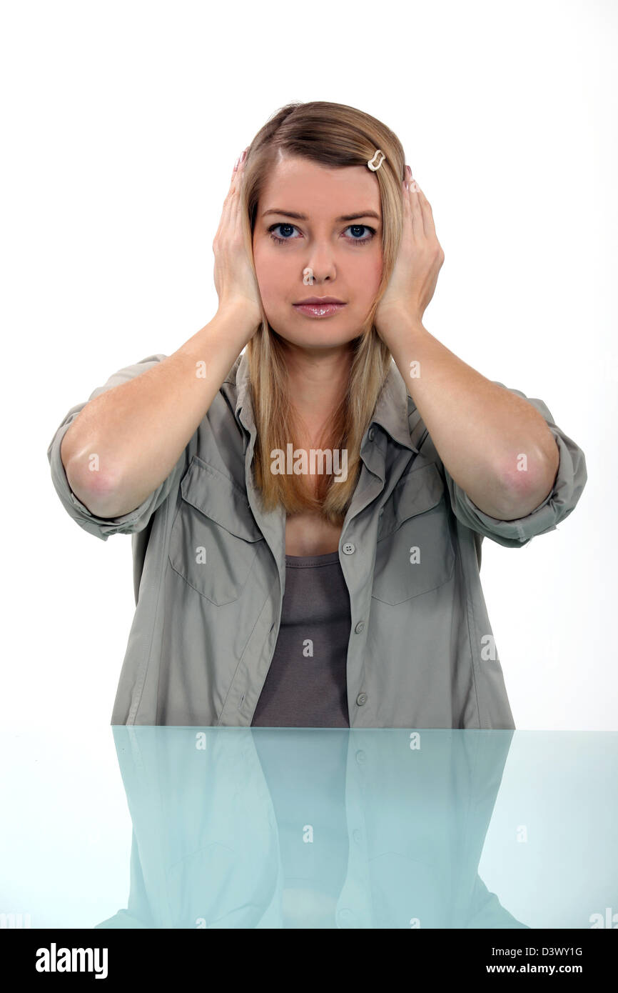 Woman covering ears Stock Photo - Alamy