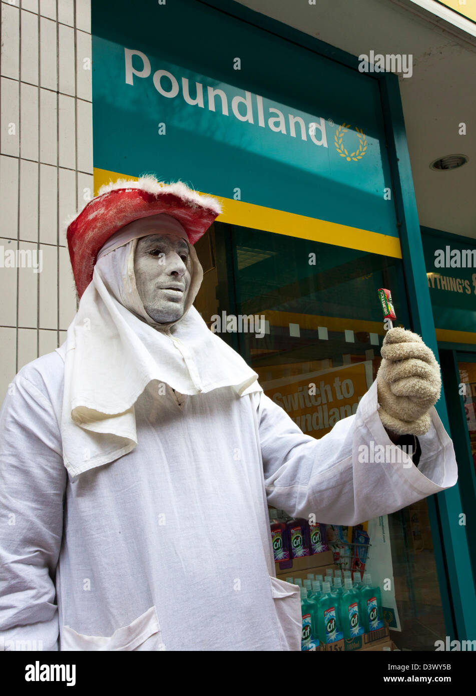 White Human Statue, street artist, mannequin; A hatted guy giving ...