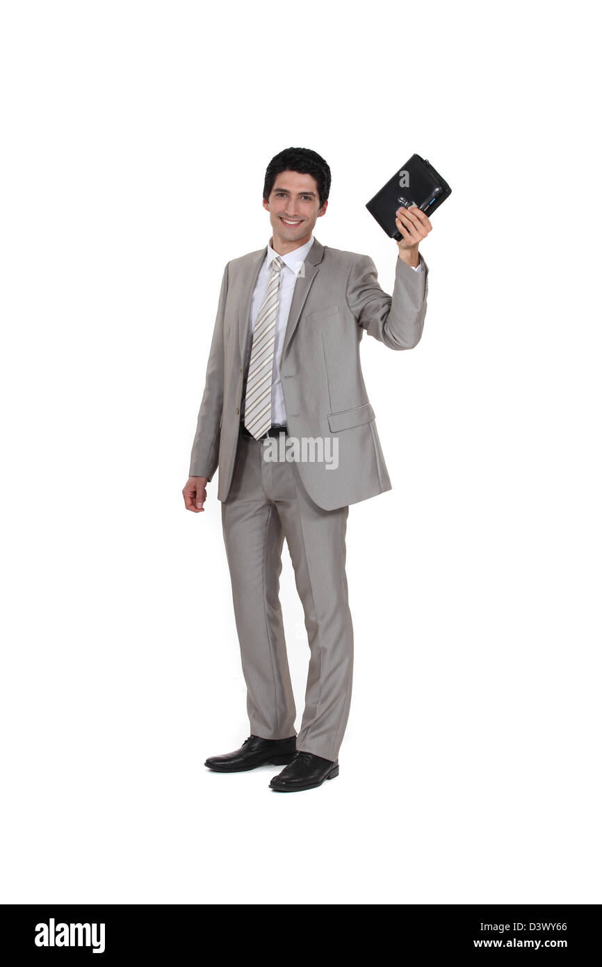 Businessman holding his leather-bound agenda Stock Photo - Alamy Businessman holding his leather-bound agenda Stock Photo - Alamy