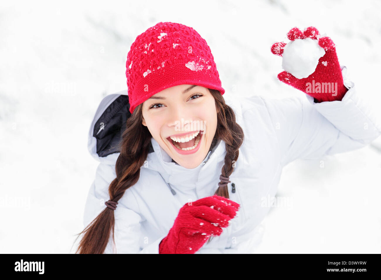 Cute playful multicultural Asian Caucasian young woman throwing ...