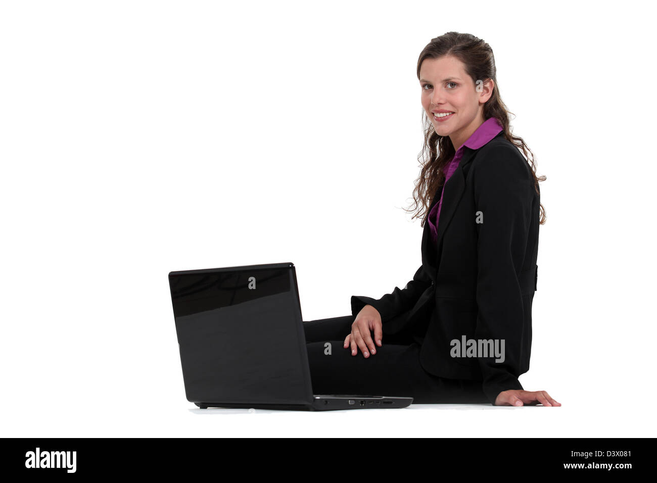Businesswoman sitting on the floor with her laptop Stock Photo - Alamy