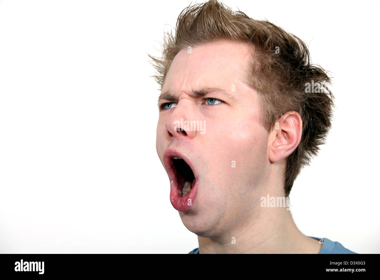 man shouting against studio background Stock Photo - Alamy