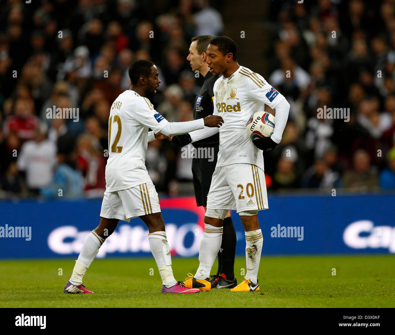 London, UK. 24th February 2013. Swansea's Nathan Dyer argues with ...