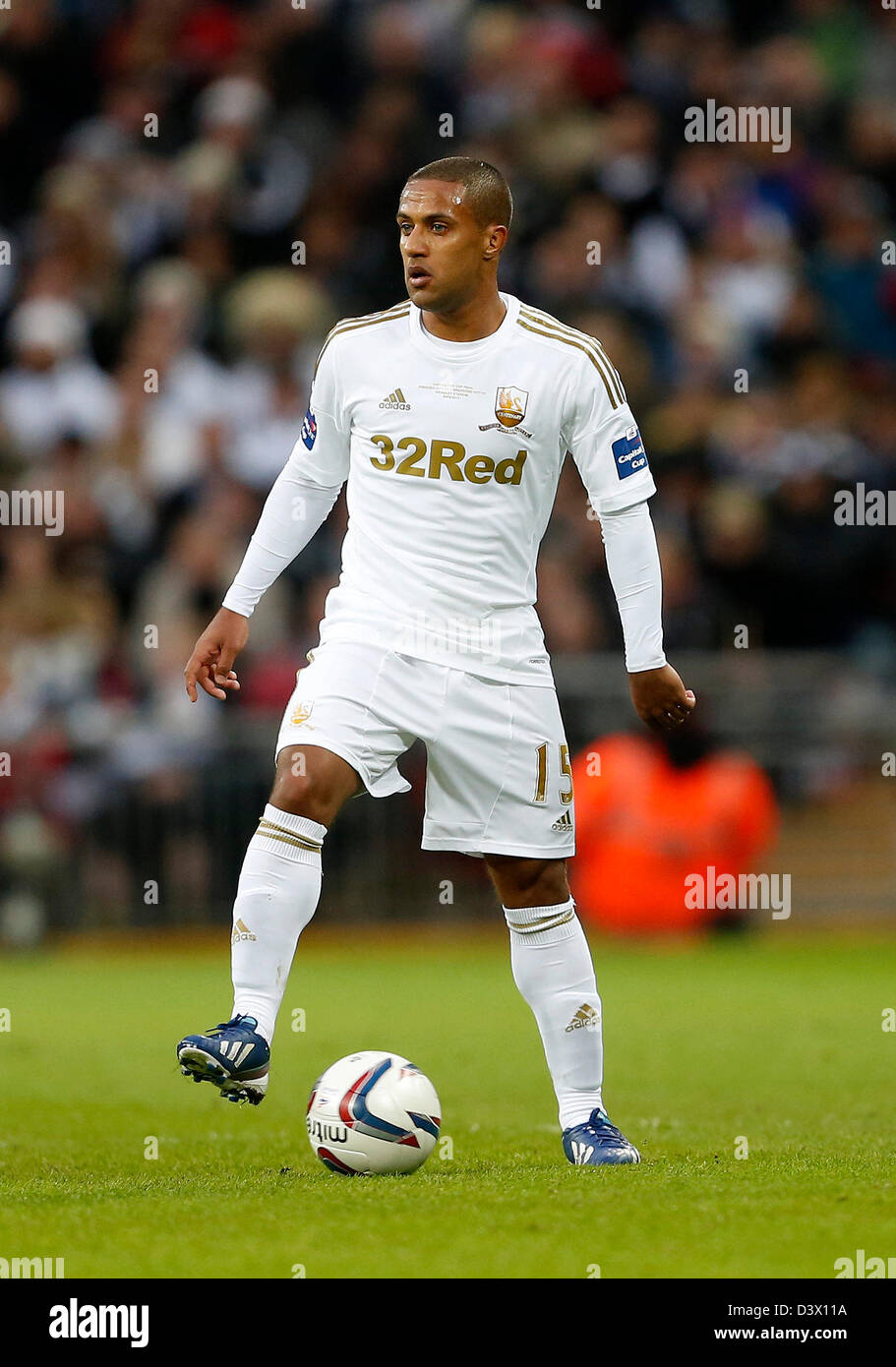 London, UK. 24th February 2013. Swansea's Wayne Routledge in action ...