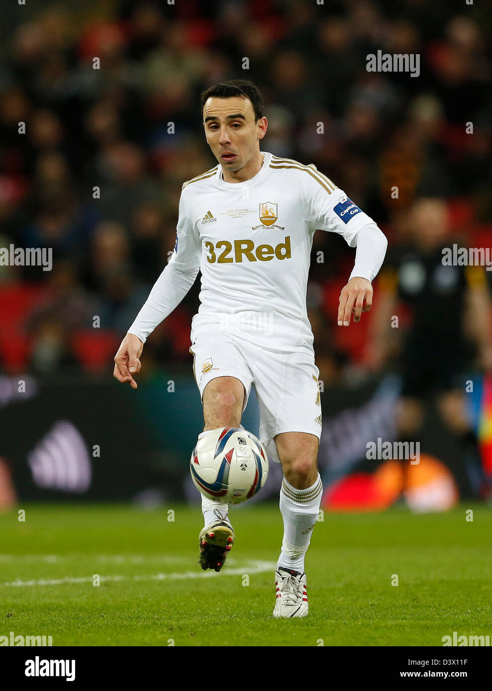 London, UK. 24th February 2013. Swansea's Leon Britton in action ...