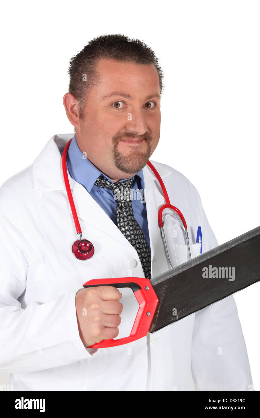 Spooky doctor holding saw, studio shot Stock Photo - Alamy