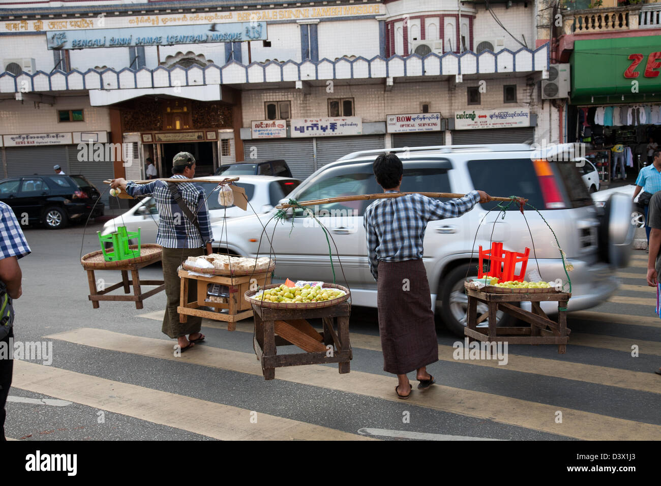 Street vendor crossing the road Yangon Myanmar Stock Photo - Alamy