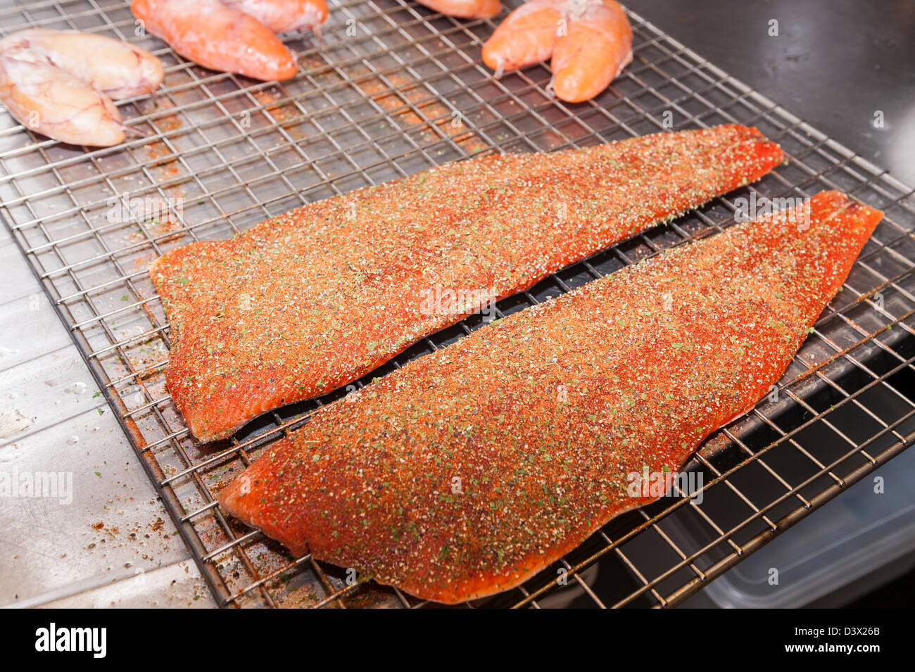 Salmon and cod roe being prepared to be smoked at a smoke house in the ...