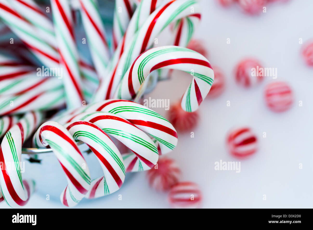 Peppermint candy canes on white background Stock Photo - Alamy