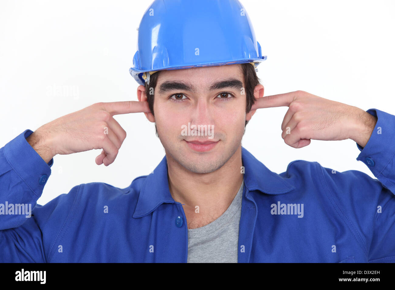 craftsman plugging his ears Stock Photo - Alamy