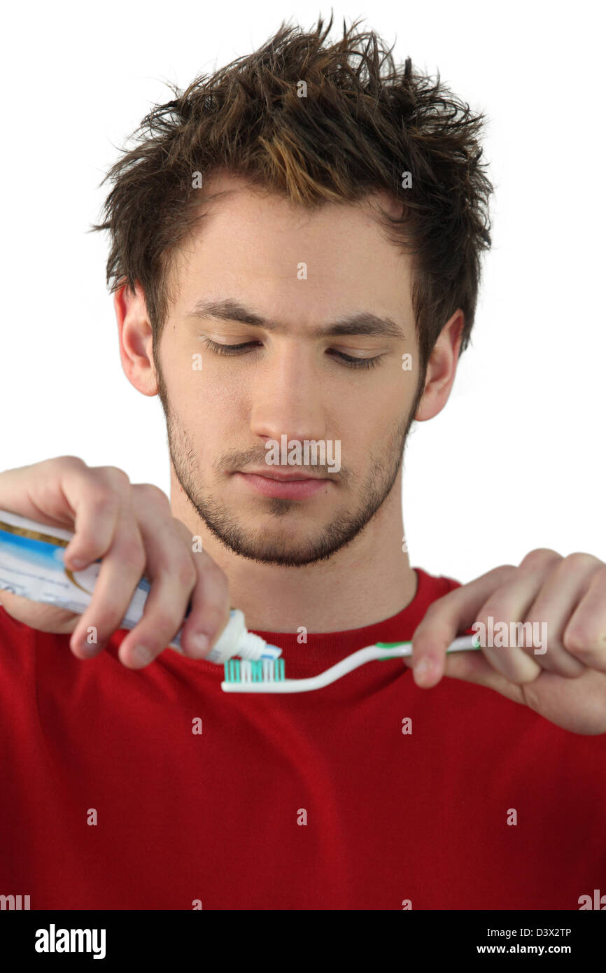 Squeezing Toothpaste Onto Toothbrush High Resolution Stock Photography ...