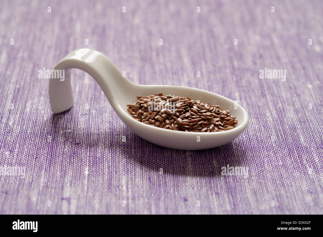 Close up view of organic Flax Seeds (Linseeds) in a ceramic spoon Stock ...