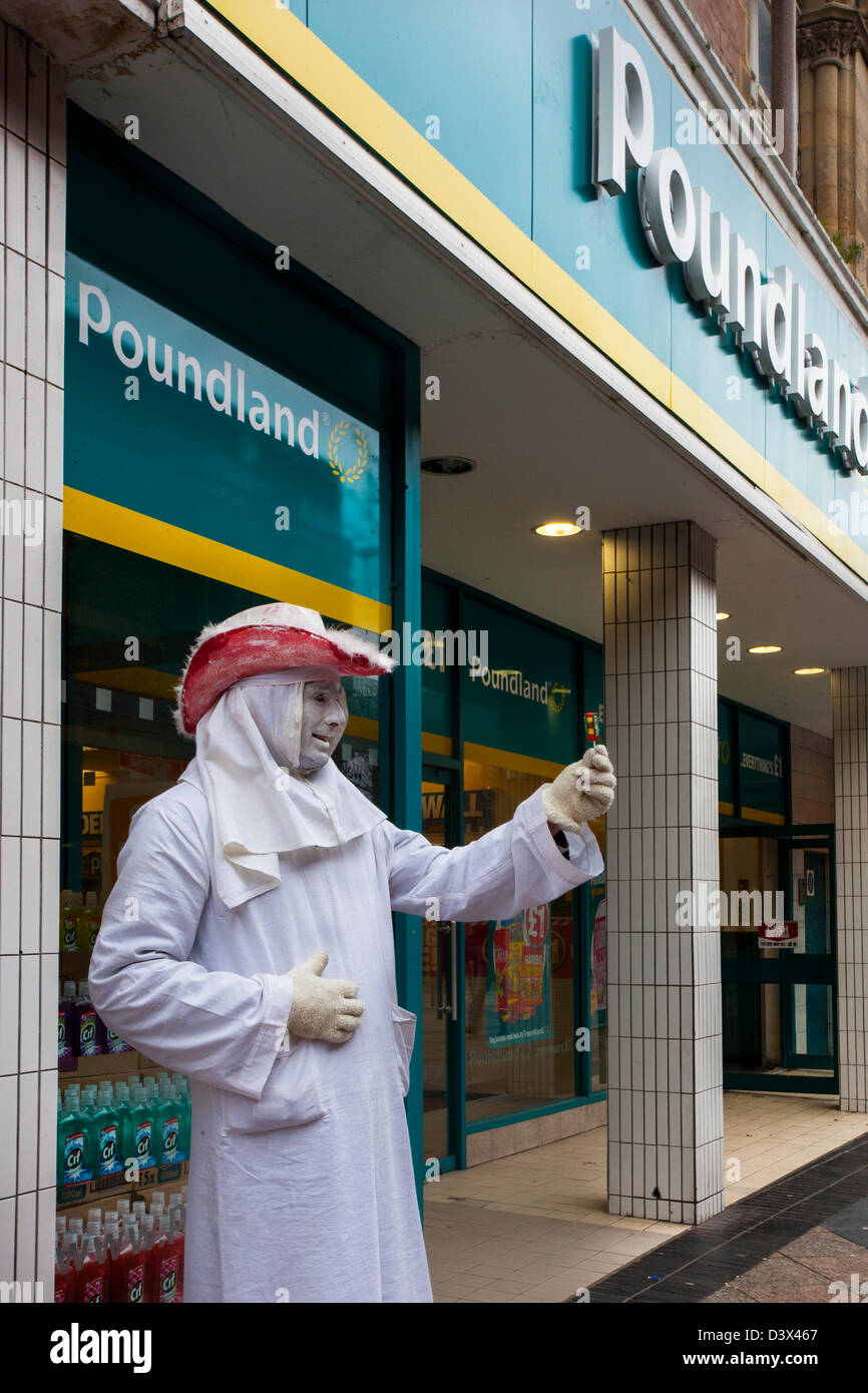 White Human Statue, street artist, mannequin; A hatted guy giving ...