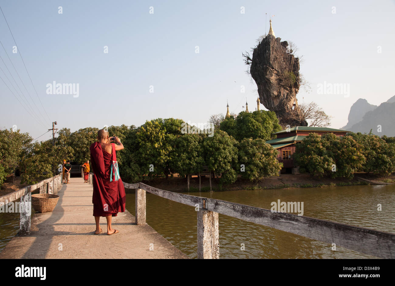 Monks visiting Kyauk Ka Lat Pagoda, Karst Mountains near Hpa-An, Kayin ...
