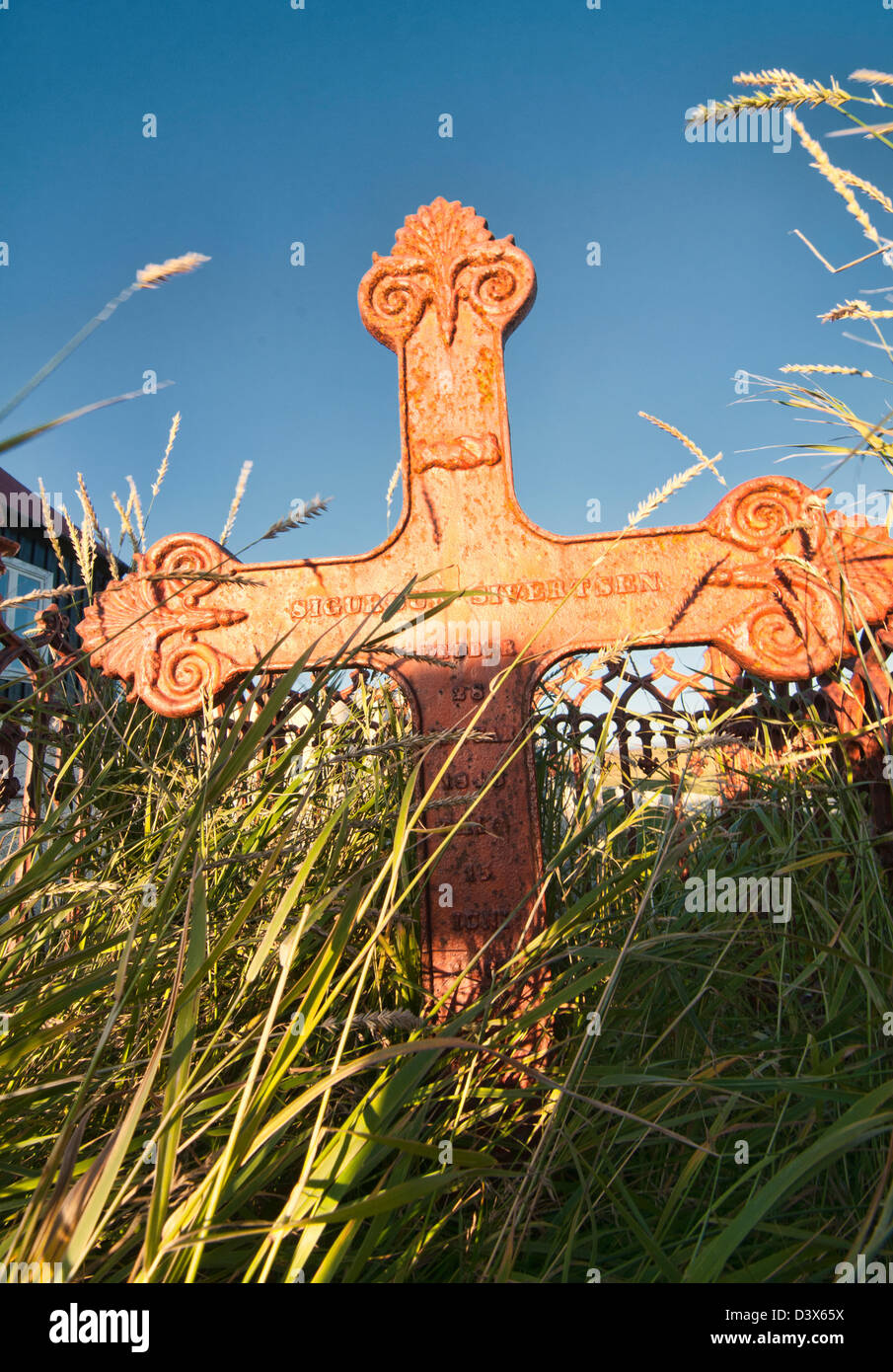 old iron cross in the cemetery at Hafnir Church in Reykjanes, Southwest ...