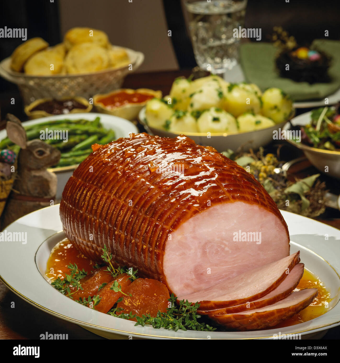 Family dinner servings, honey glazed, baked ham Stock Photo - Alamy