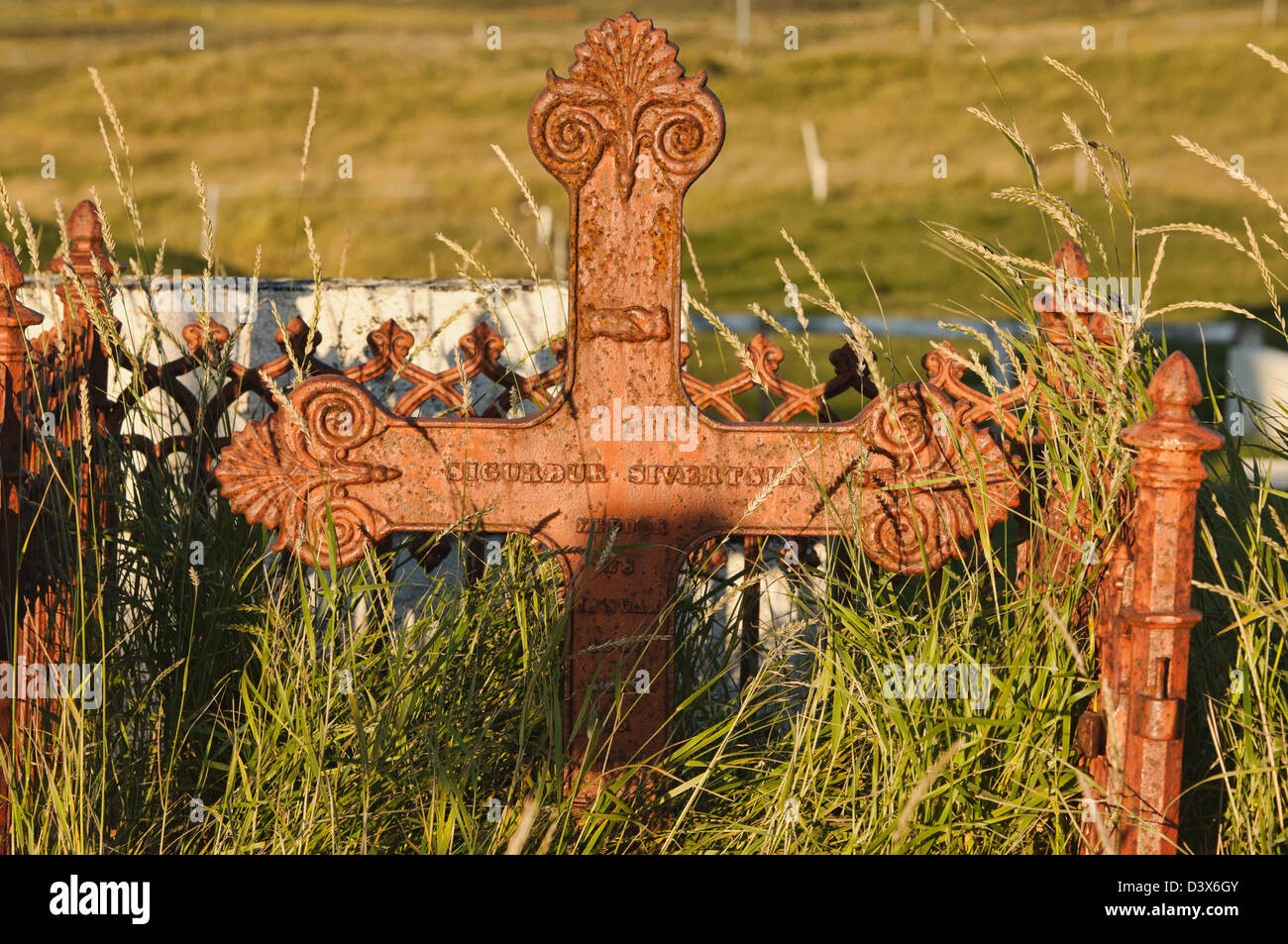 old iron cross in the cemetery at Hafnir Church in Reykjanes, Southwest ...