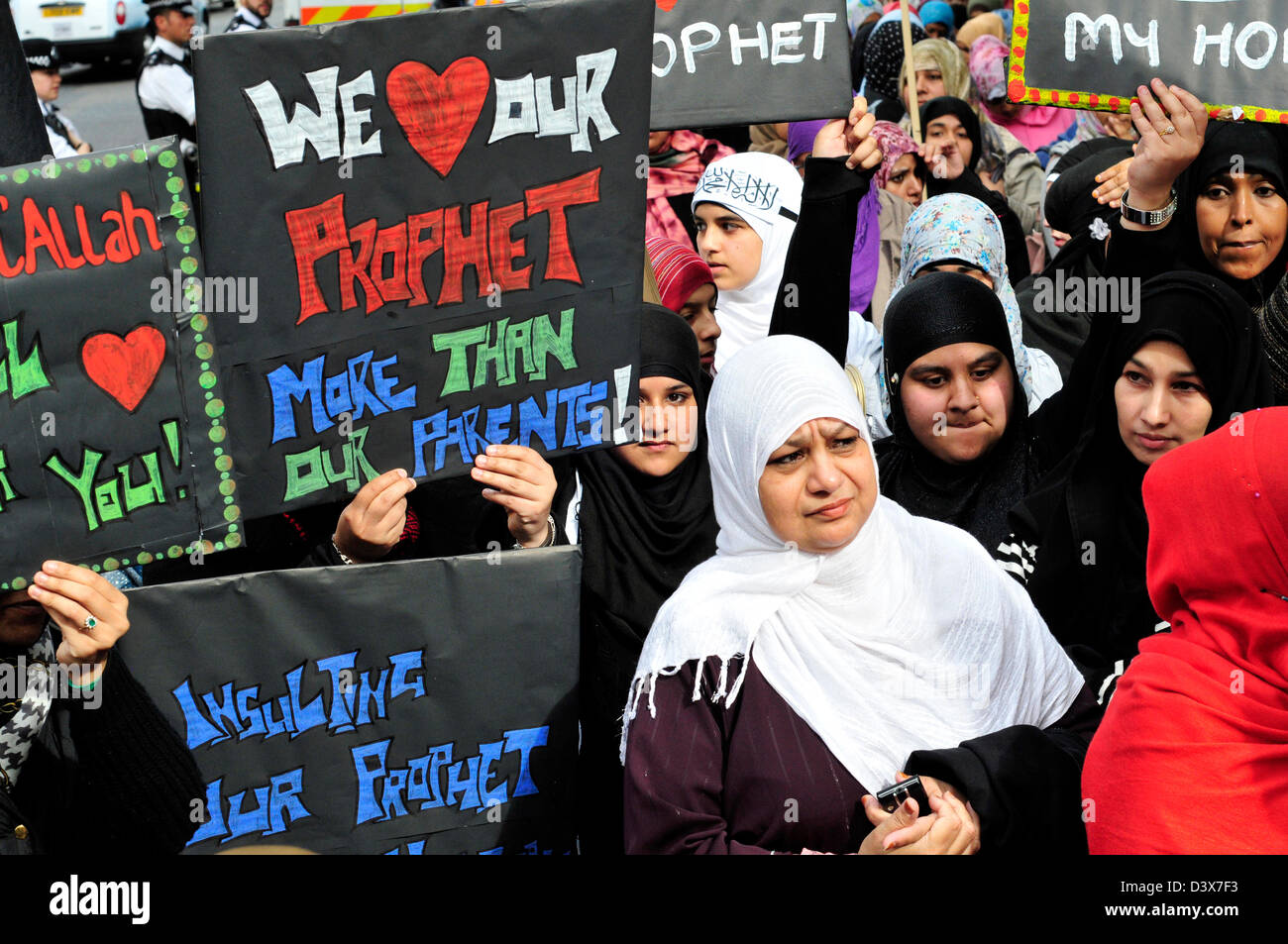 Women protesters hold a banner "We love our prophet more than our ...
