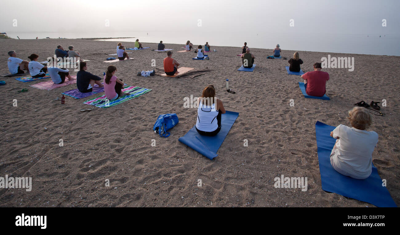 Outdoor beach yoga class in CT USA Stock Photo - Alamy