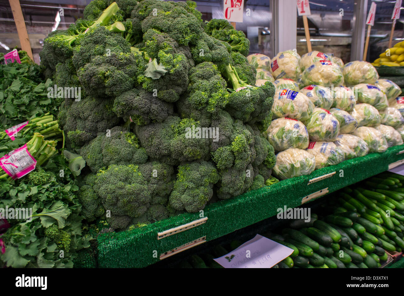 Broccoli, cauliflower and other vegetables are seen on sale in a ...