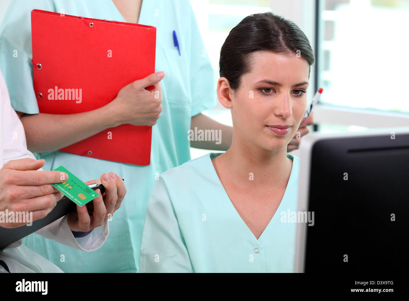 Nurse at a computer Stock Photo - Alamy