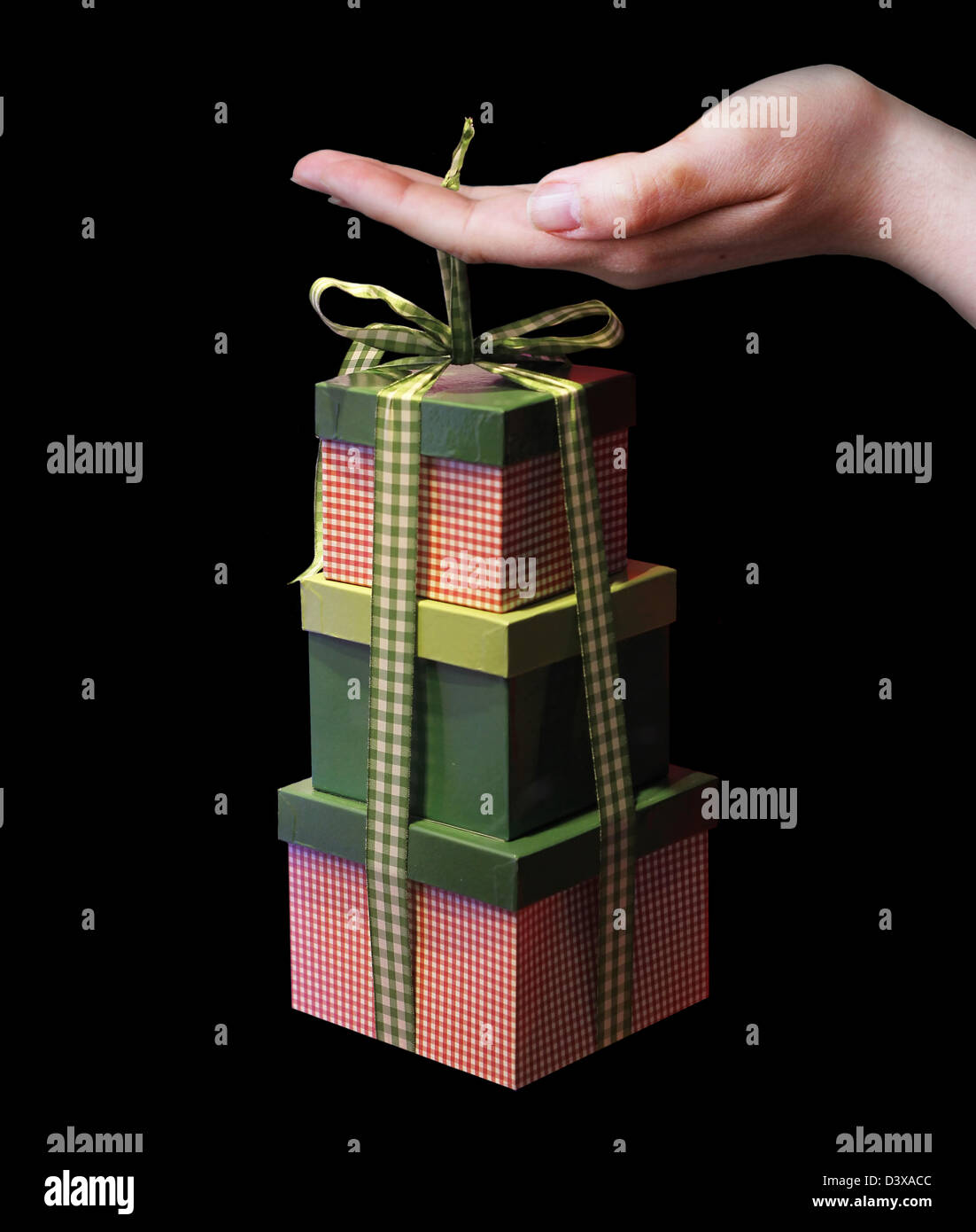 woman's hand holding gift boxes Stock Photo - Alamy
