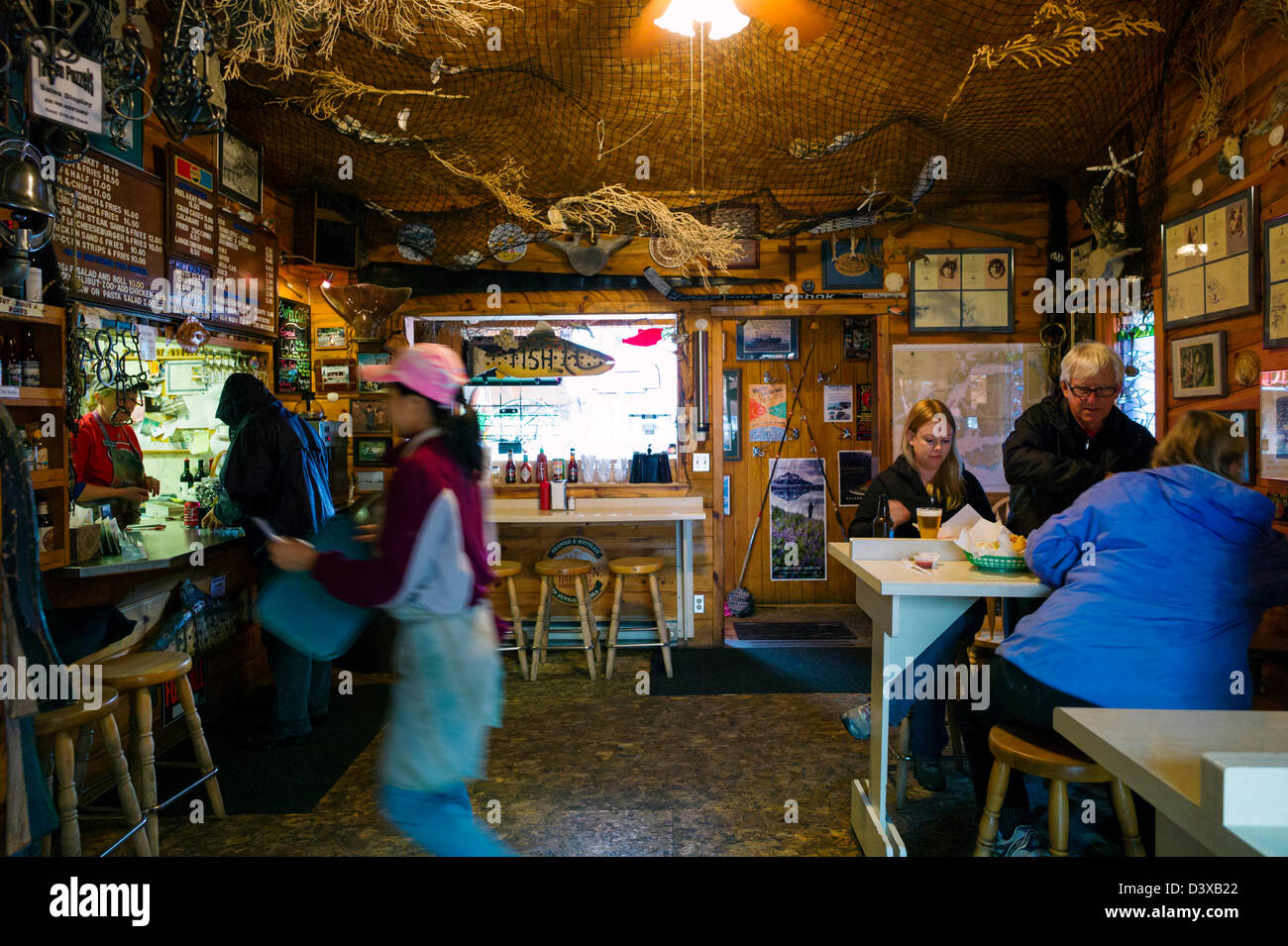 Visitors dining inside the Swiftwater Seafood Cafe, Whittier, Alaska ...