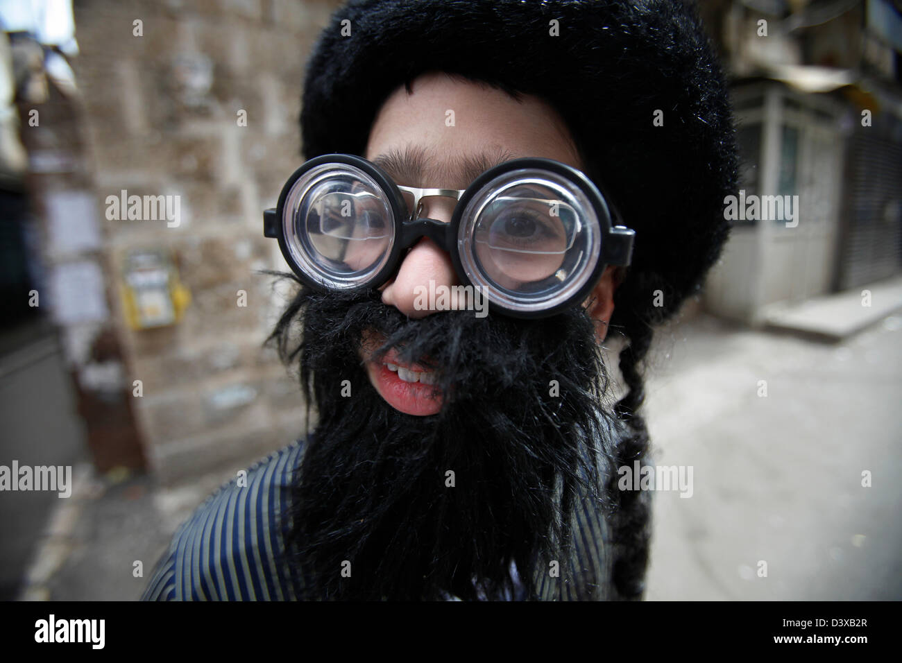 A Haredi Jew wearing costume during the Jewish holiday of Purim in Mea ...