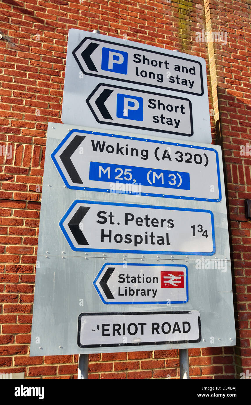Road signs on wall, Heriot Road, Chertsey, Surrey, England, United ...