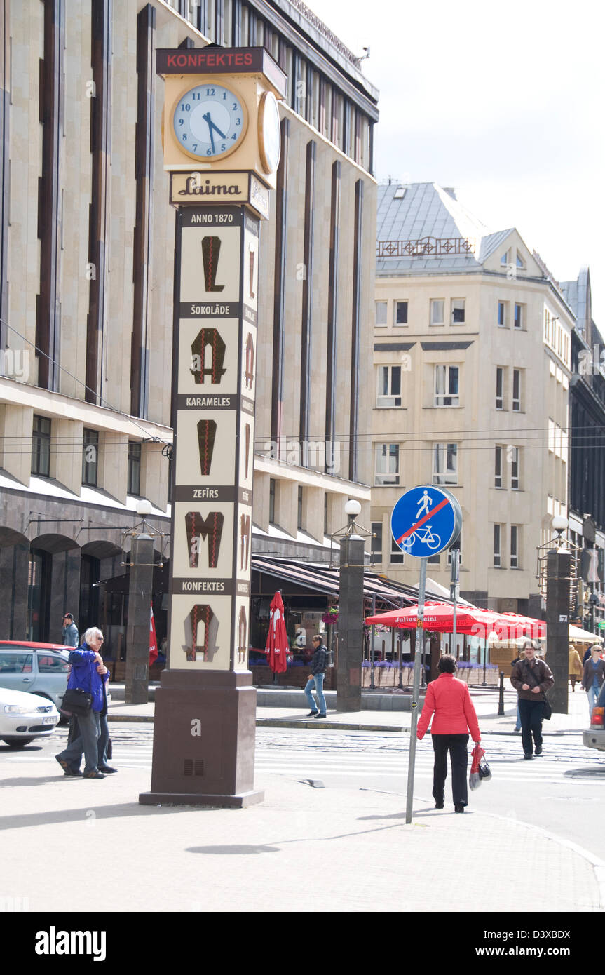 Shoppers passing the Laima Clock, a landmark in the busy shopping ...