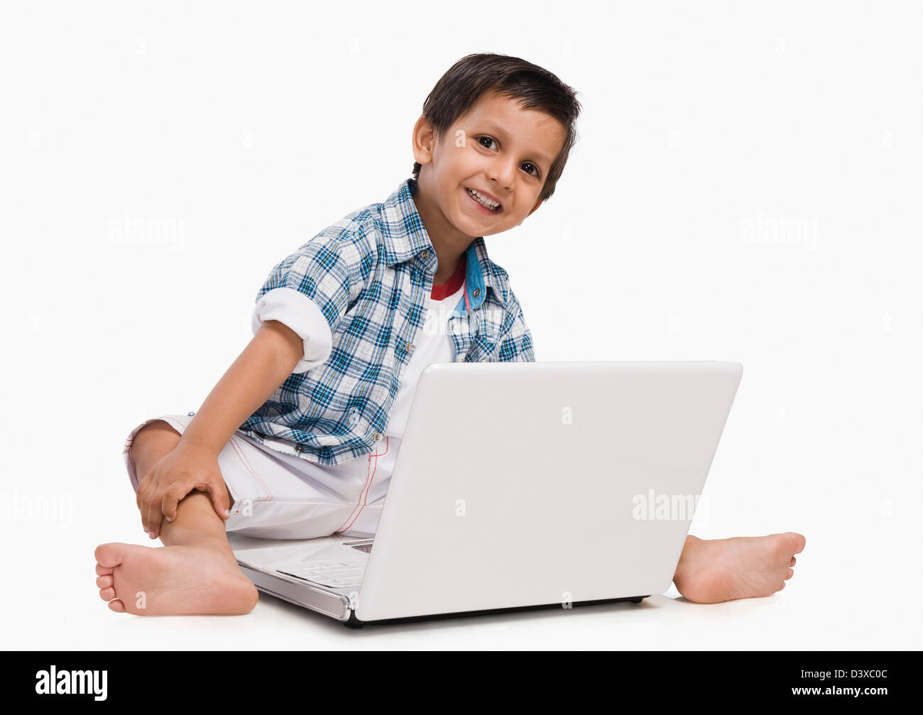Boy using a laptop Stock Photo - Alamy
