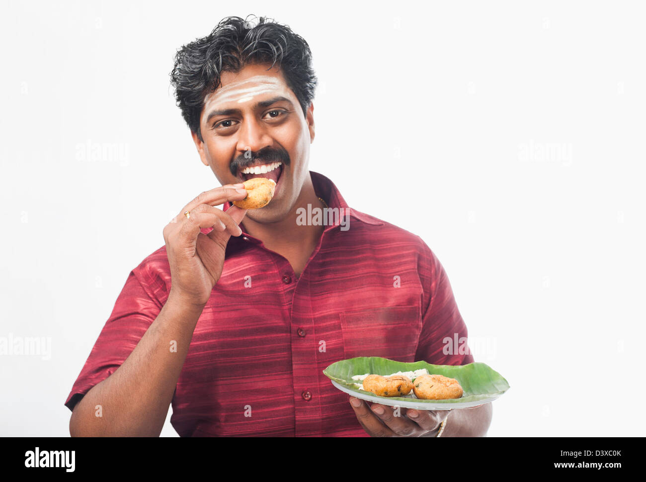 South Indian man having vada Stock Photo - Alamy