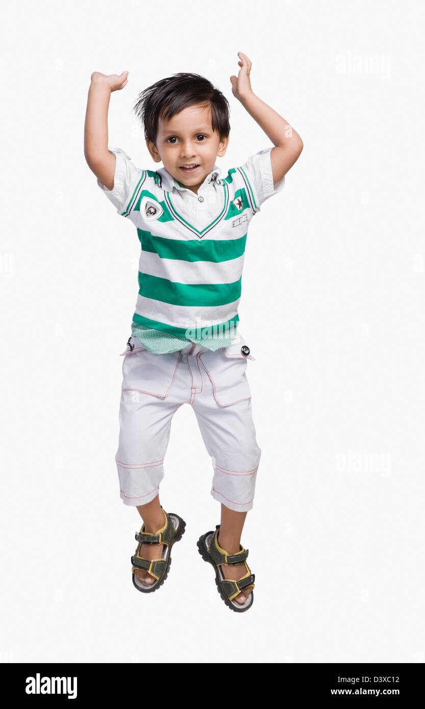 Baby boy jumping and smiling Stock Photo - Alamy