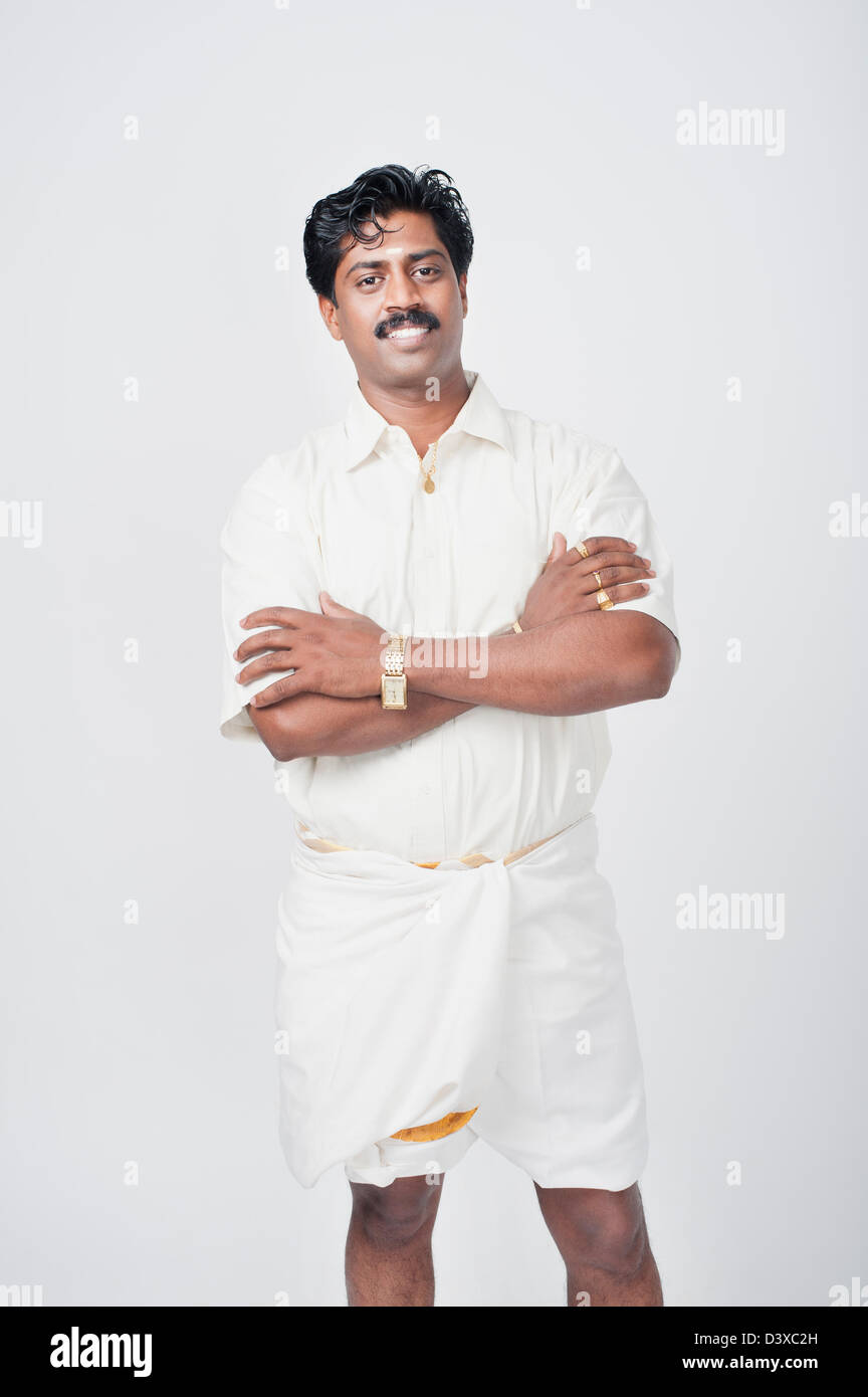 South indian man standing arms hi-res stock photography and images - Alamy