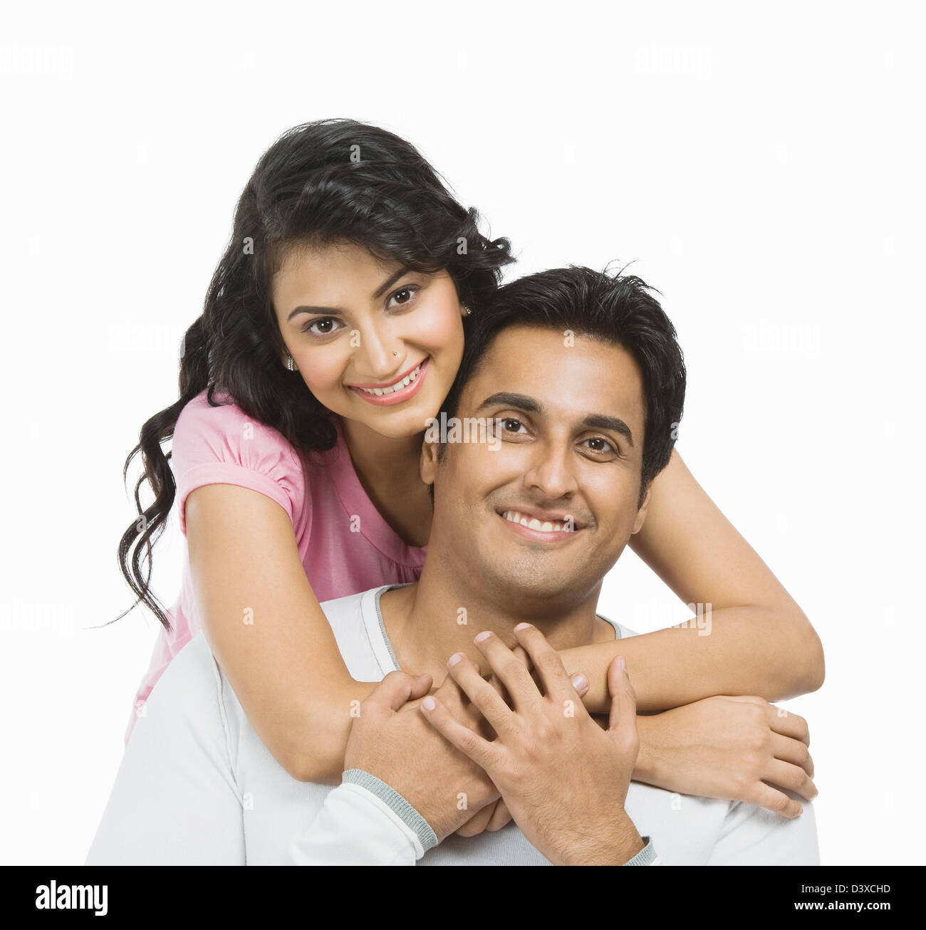 Woman hugging her husband from behind Stock Photo - Alamy