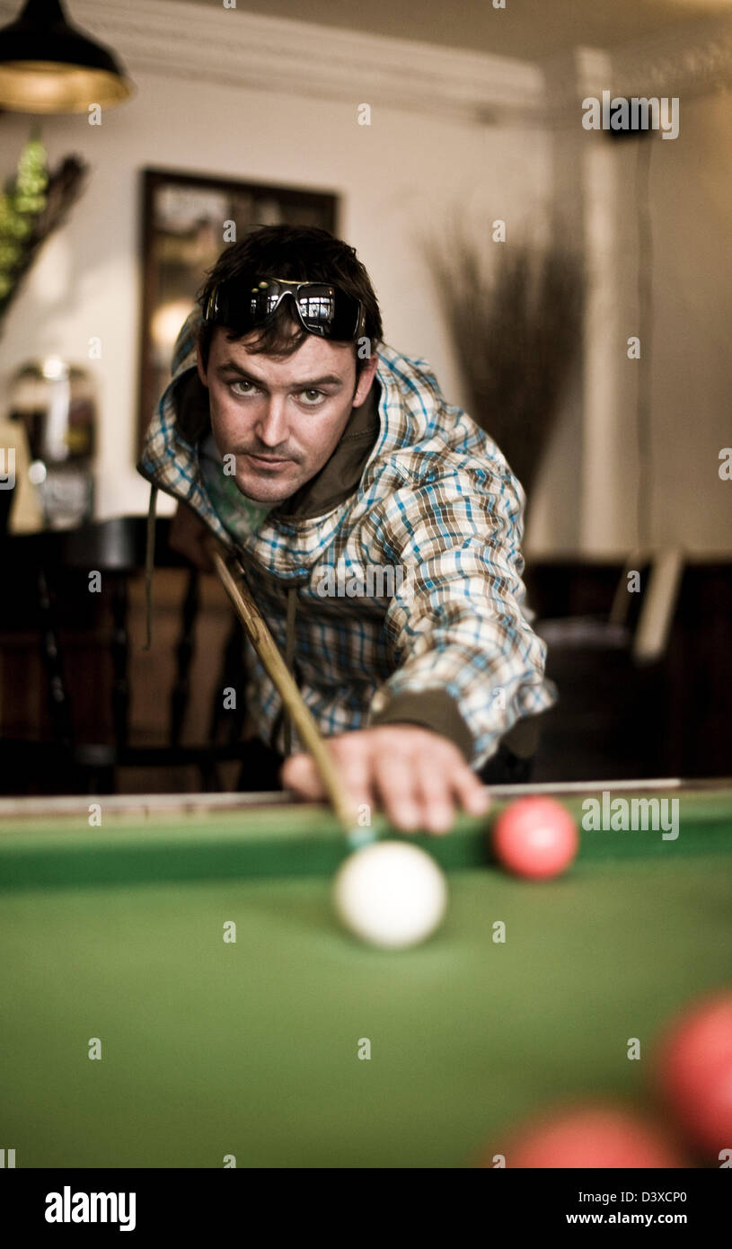 Pool player at billiards table, St Agnes, Cornwall, UK Stock Photo - Alamy