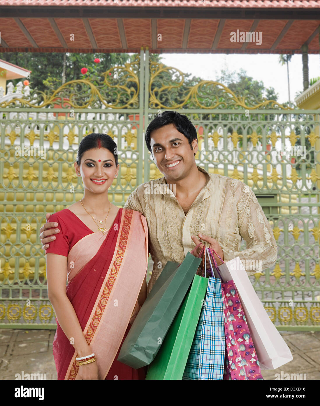 Bengali couple carrying shopping bags Stock Photo - Alamy