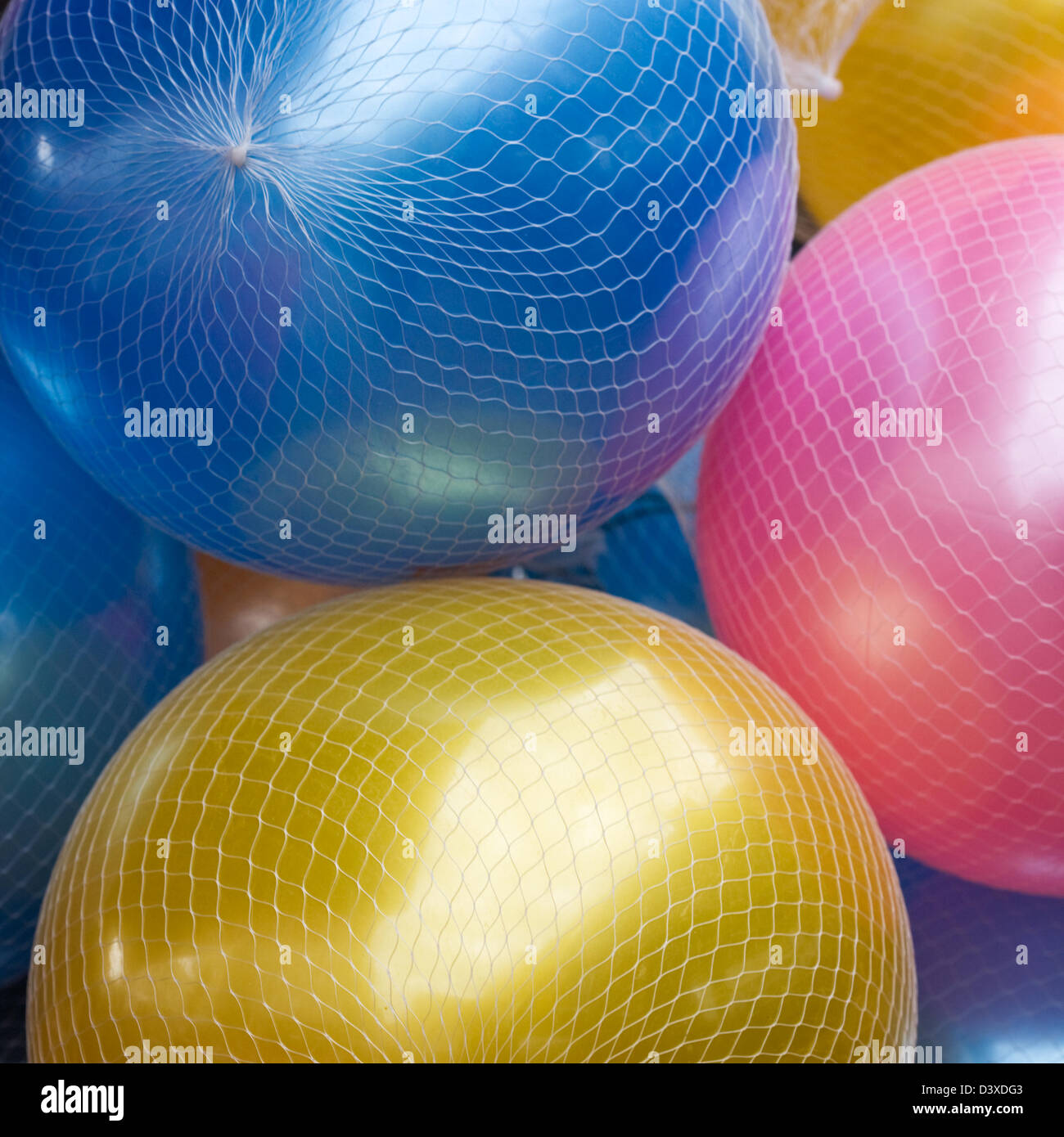 Netting beach balls for sale at market in Turkey Stock Photo - Alamy