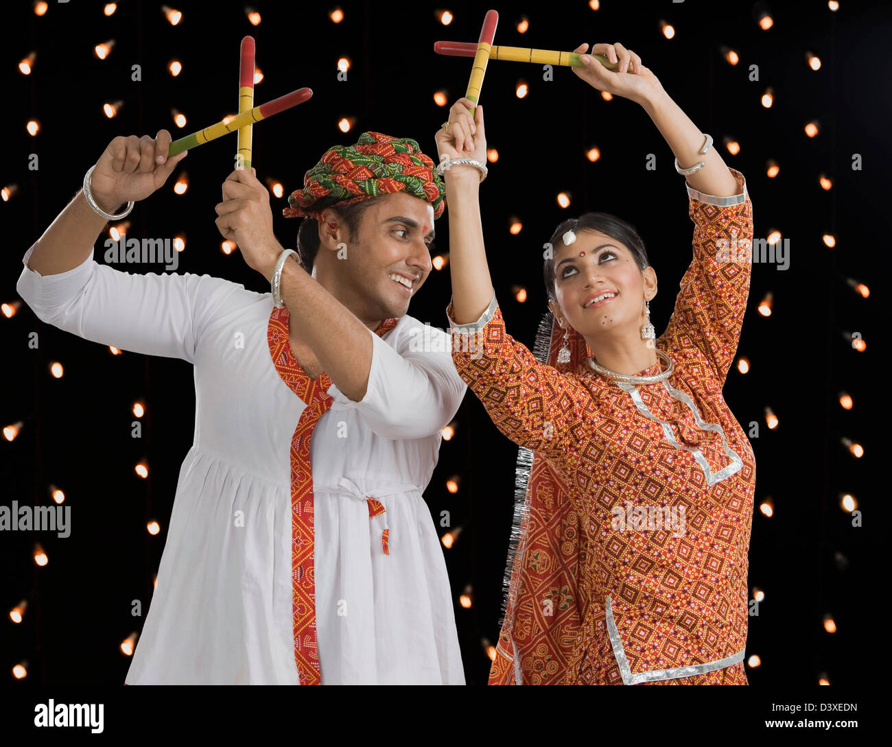 Couple performing Dandiya Raas at Navratri Stock Photo - Alamy
