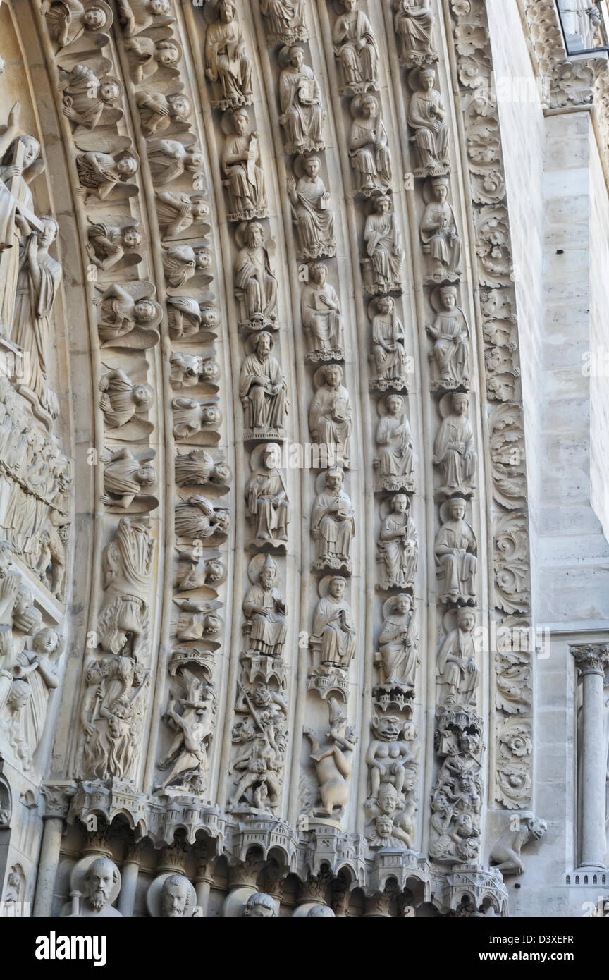 Bas relief figures at the entrance of Notre Dame Cathedral, Paris ...