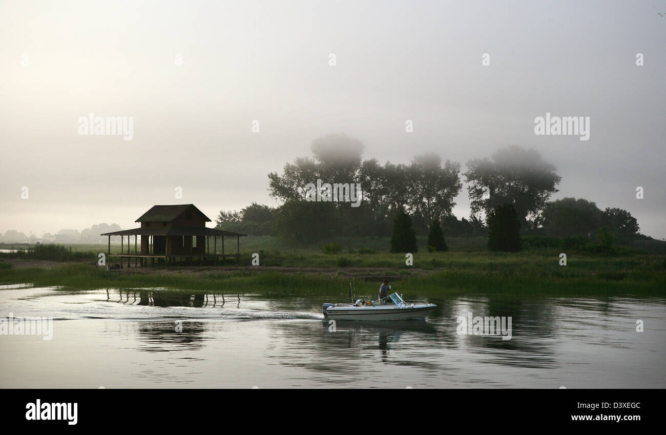 Boat in early morning Mist in New England Stock Photo - Alamy