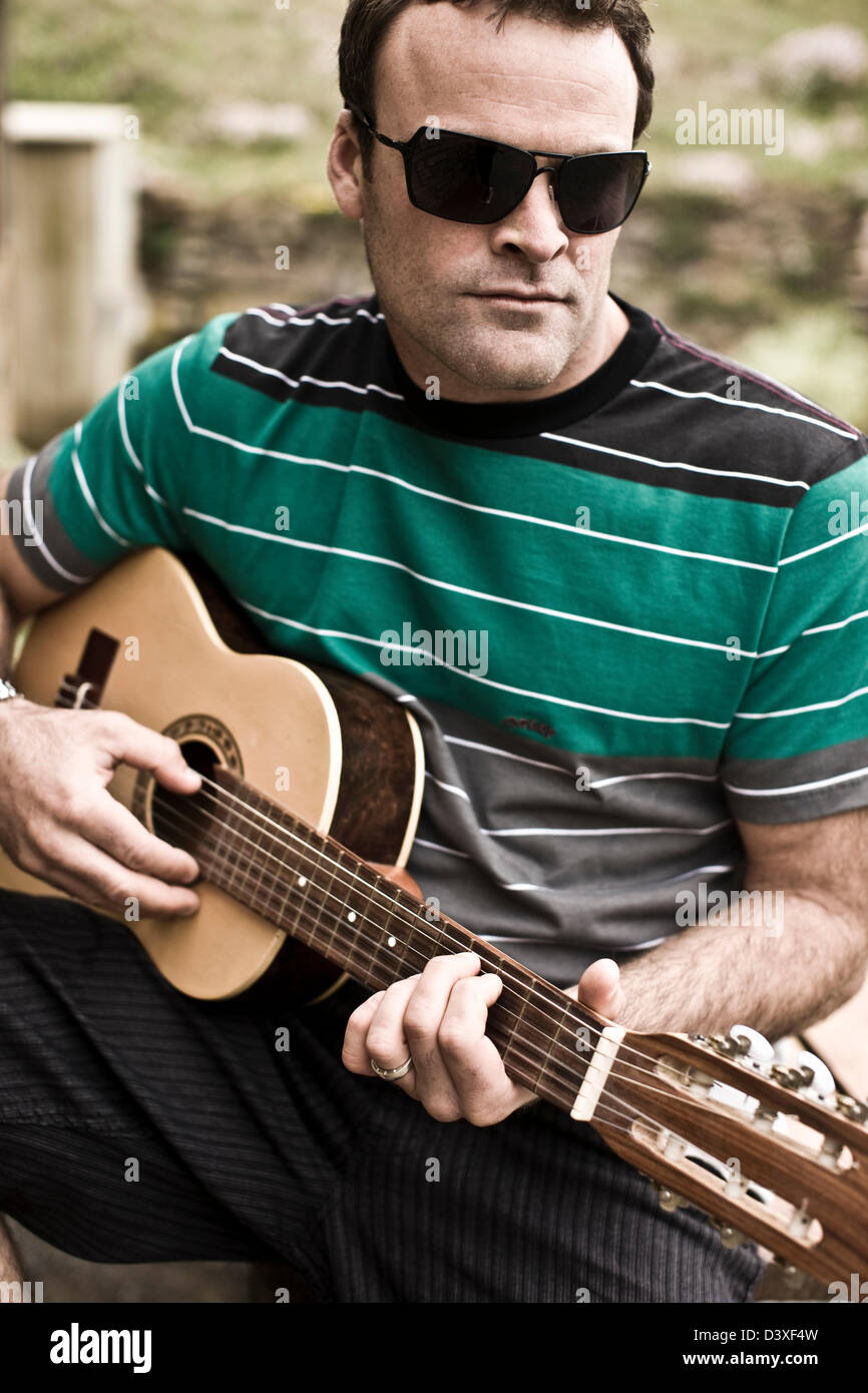 Man playing music uk hi-res stock photography and images - Alamy