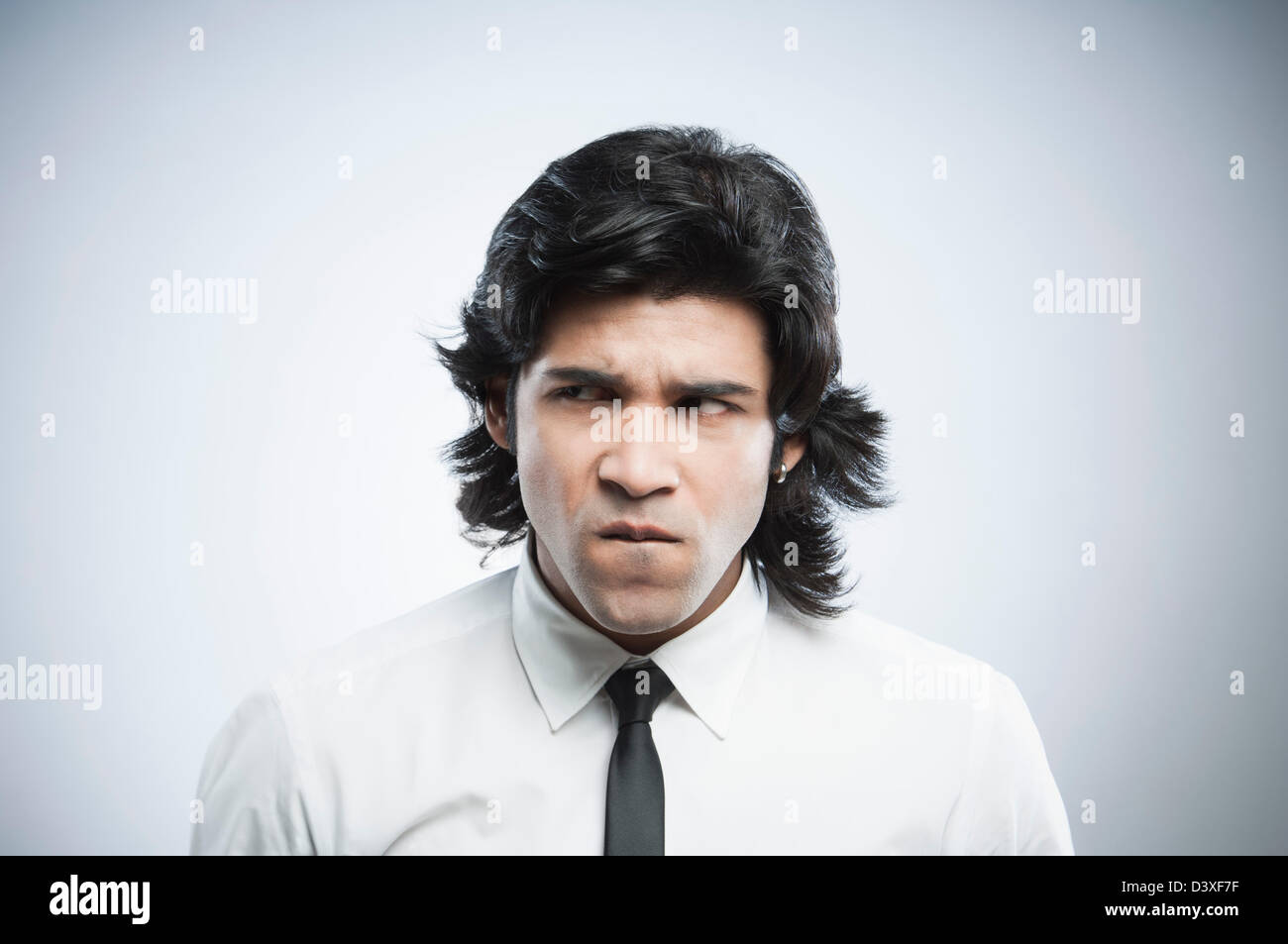 Young man glancing sideways hi-res stock photography and images - Alamy