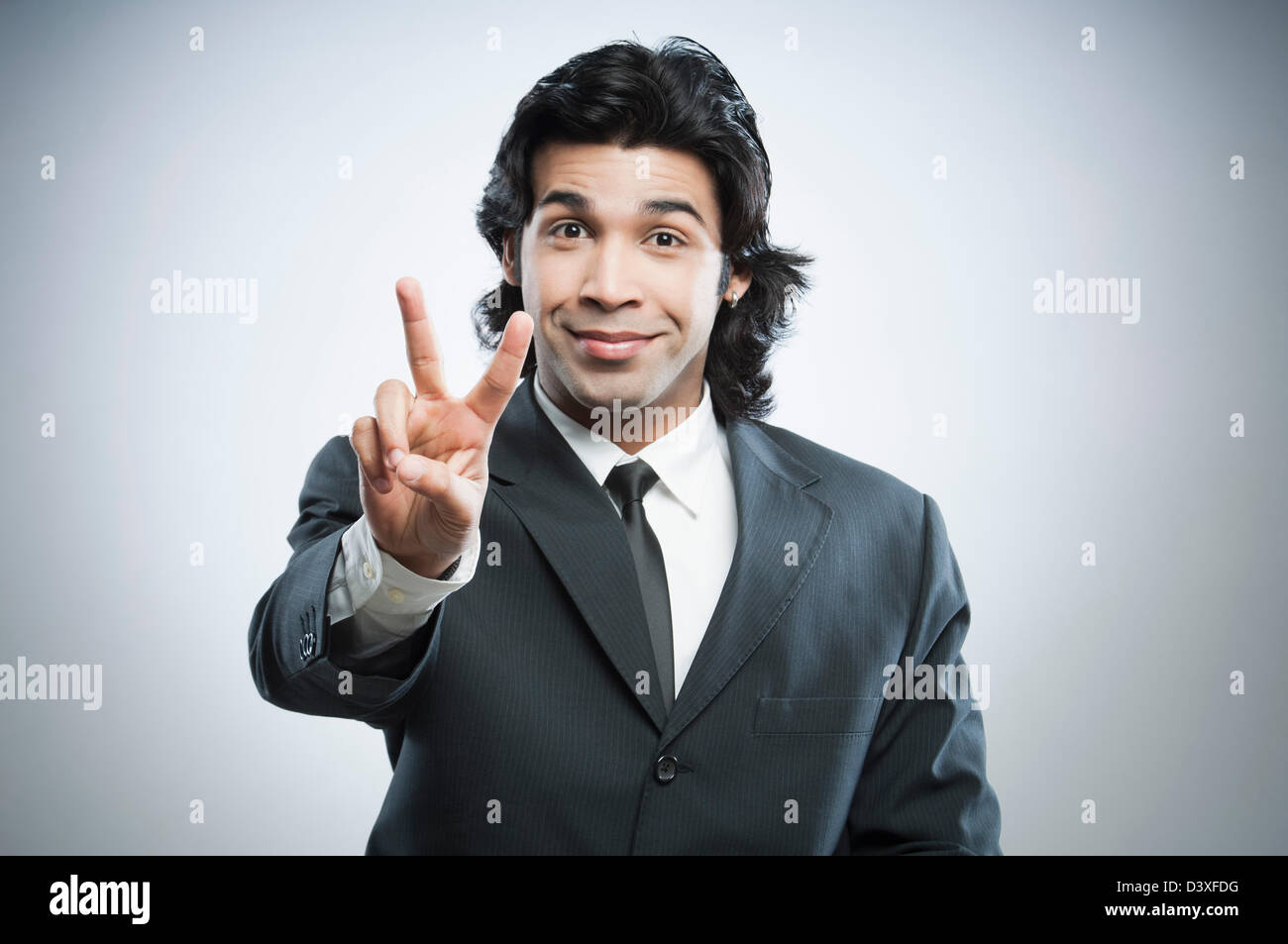 Businessman showing victory sign Stock Photo - Alamy Businessman showing victory sign Stock Photo - Alamy