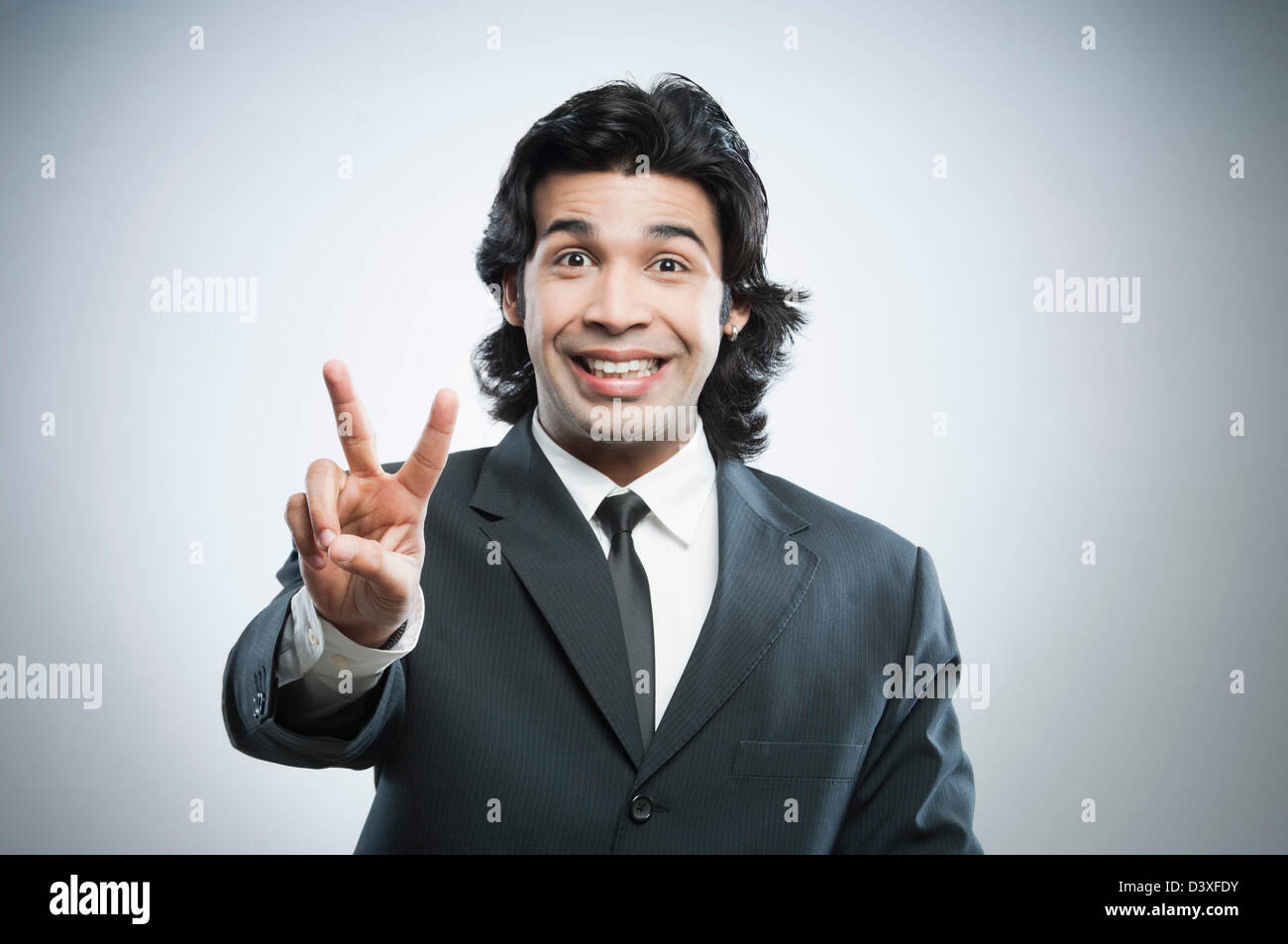 Businessman showing victory sign Stock Photo - Alamy Businessman showing victory sign Stock Photo - Alamy