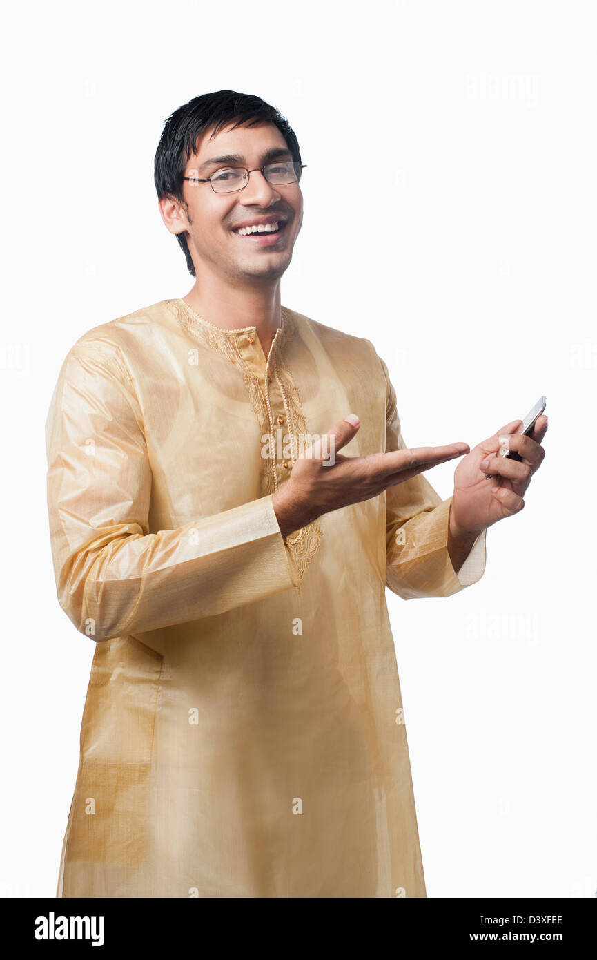 Bengali man text messaging on a mobile phone Stock Photo - Alamy