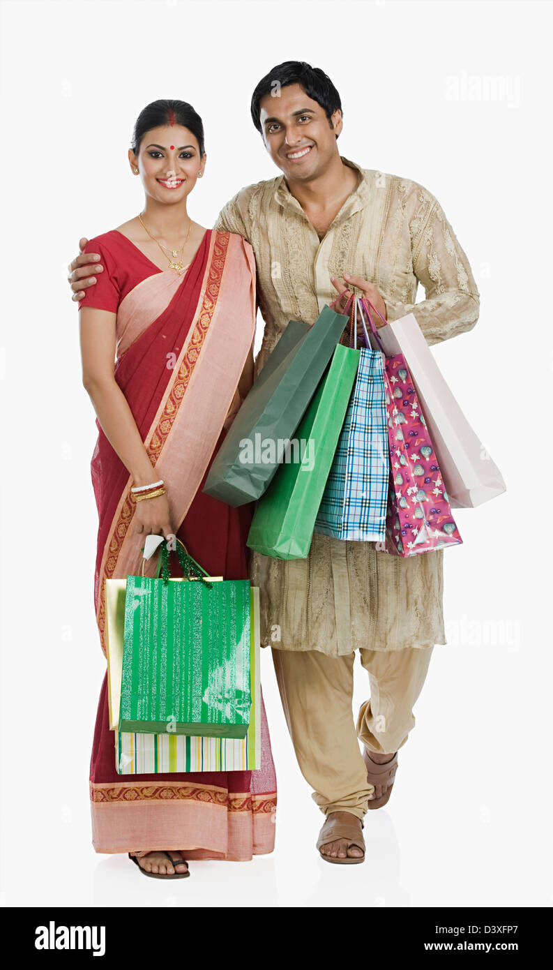 Bengali couple carrying shopping bags Stock Photo - Alamy